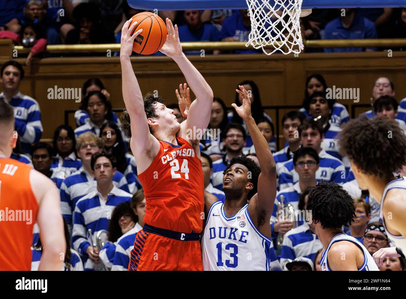 Clemson's PJ Hall (24) attempts to shoot over Duke's Sean Stewart (13 ...