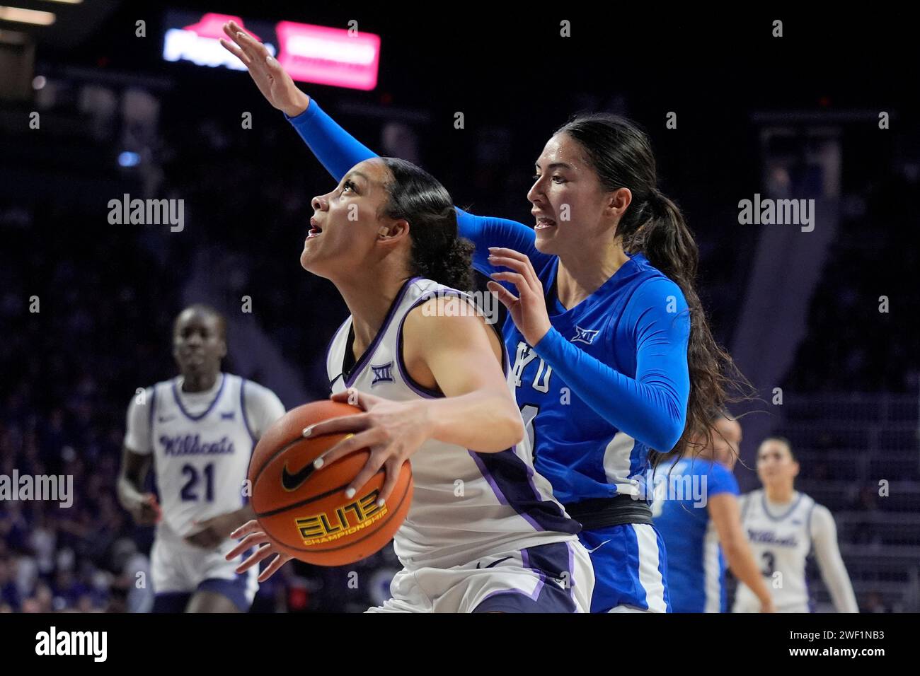 Kansas State guard Brylee Glenn, left, looks to shoot under pressure ...