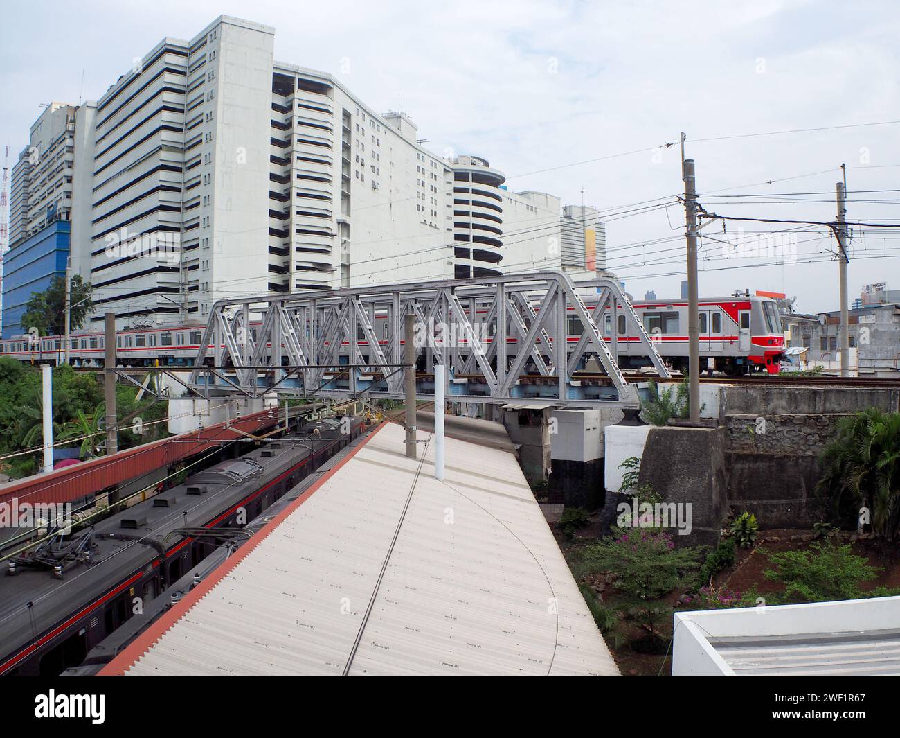 Commuter line, electric train PT. KAI in Kampung Bandan Train Station ...