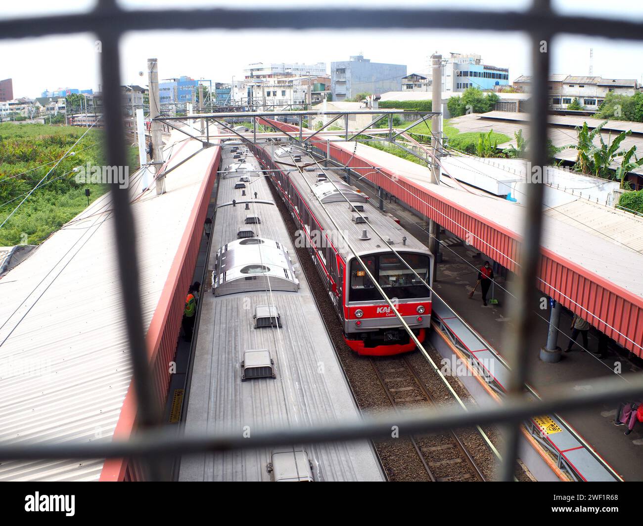 Commuter line, electric train PT. KAI in Kampung Bandan Train Station ...