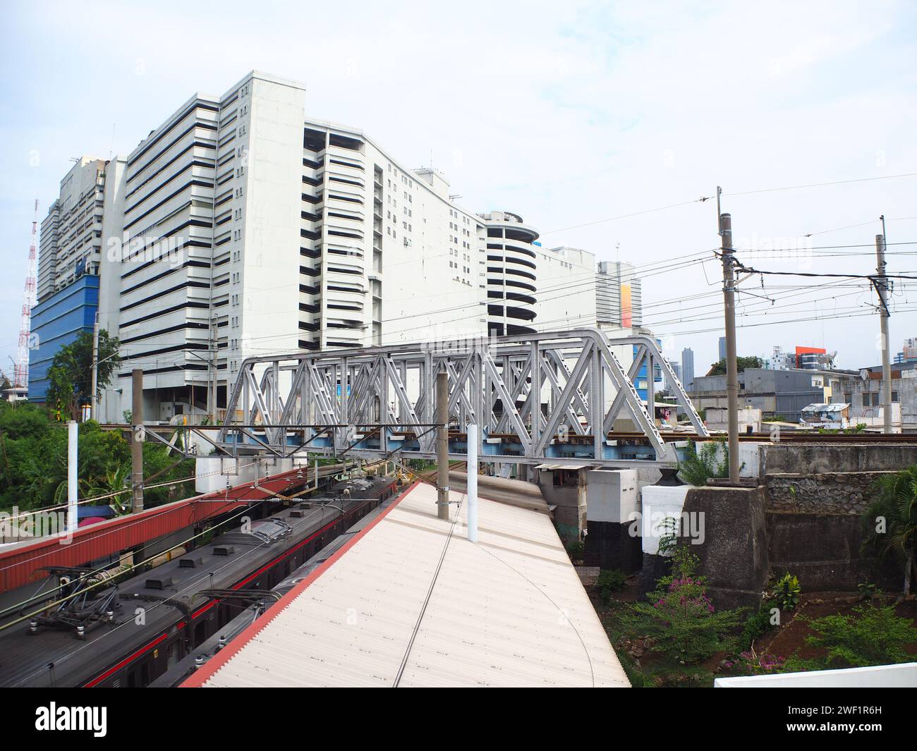 Commuter line, electric train PT. KAI in Kampung Bandan Train Station ...