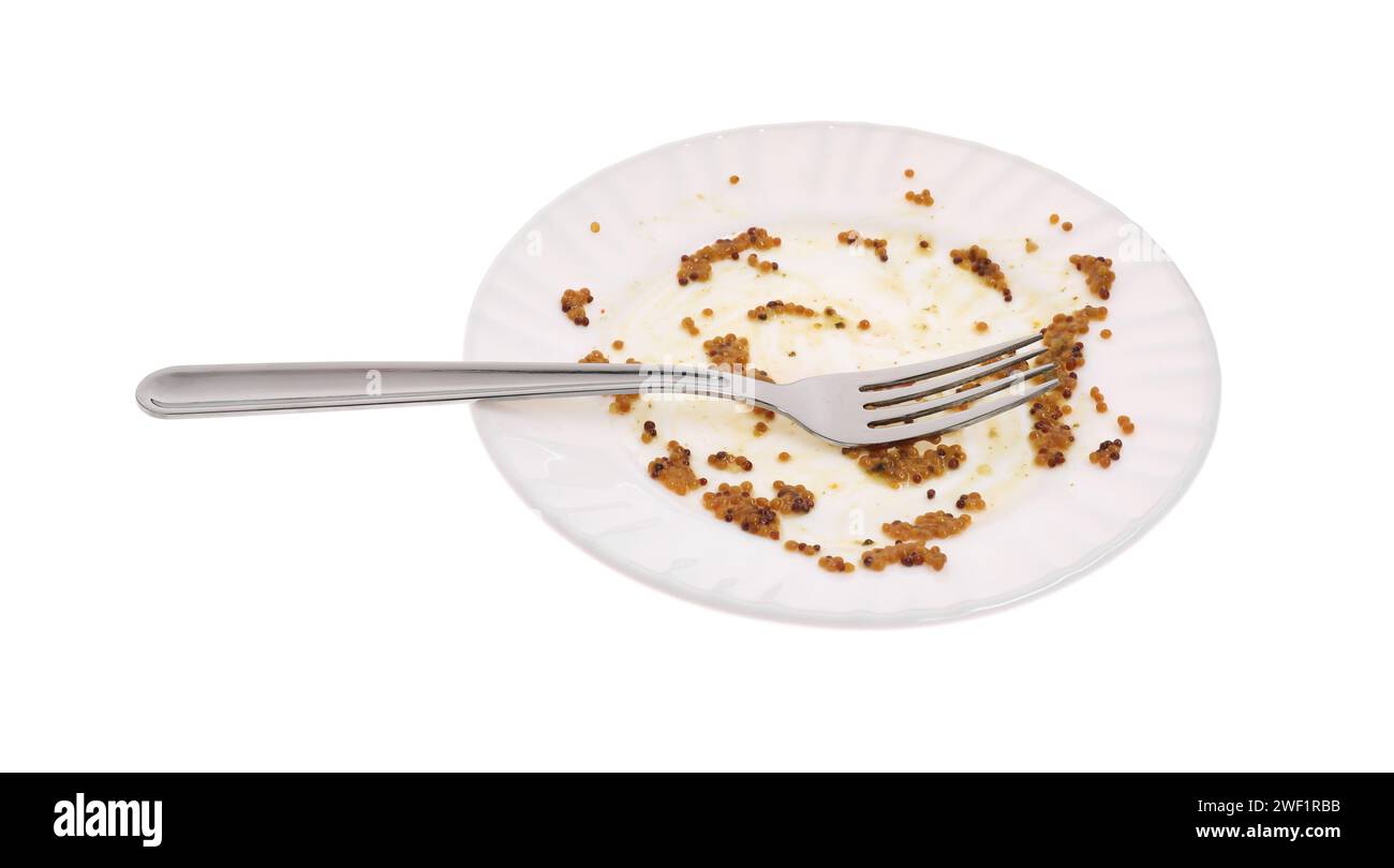 Dirty plate and fork on white background Stock Photo - Alamy