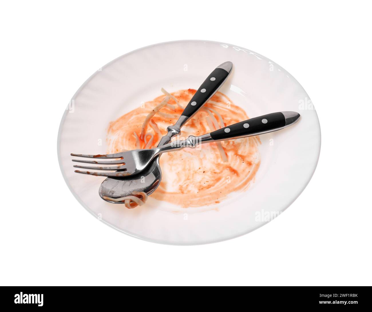 Dirty plate and cutlery on white background Stock Photo - Alamy