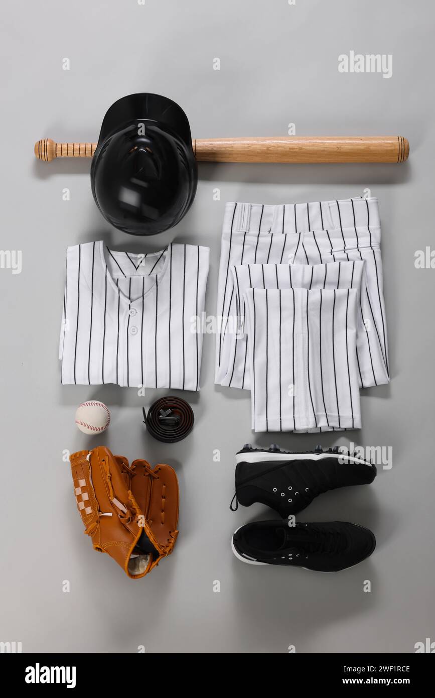 Baseball uniform and other sports equipment on white background, flat ...