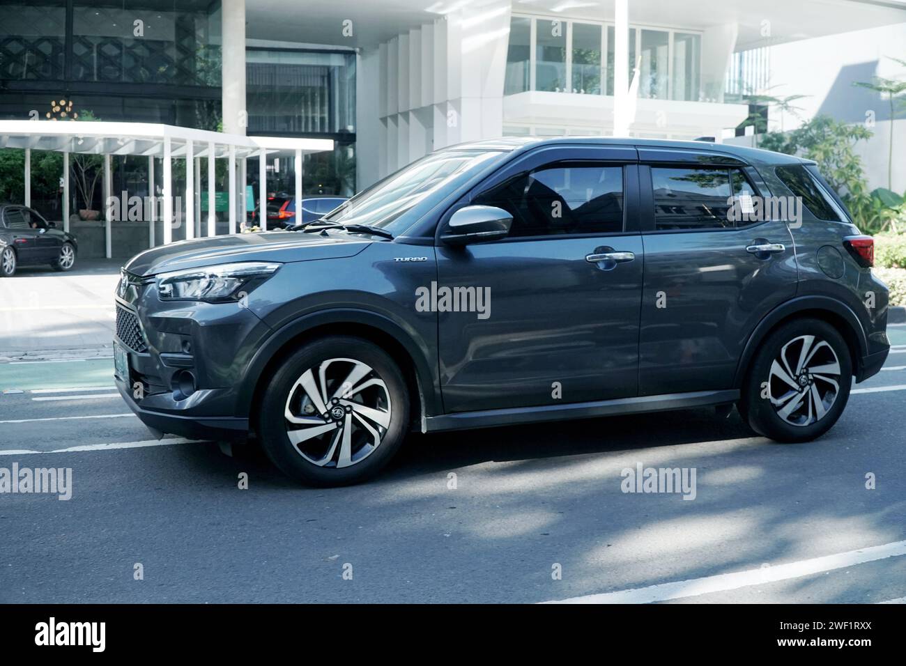 Toyota Raize 1.2 G CVT car, driving in commercial and business area ...