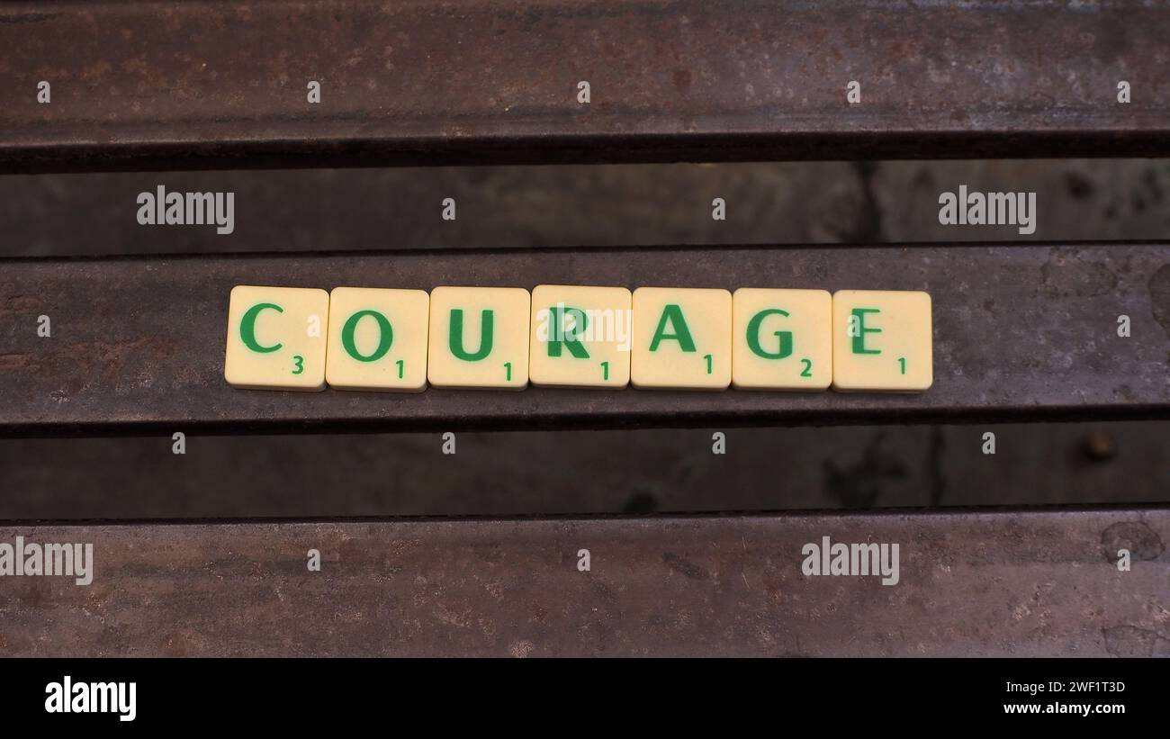 Scrabble letters spelling words Courage Stock Photo - Alamy