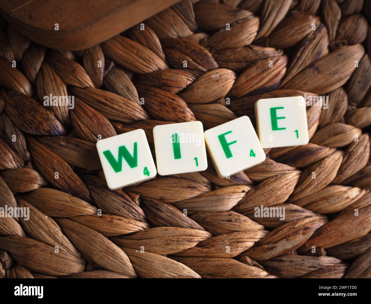 Scrabble letters spelling words WIFE Stock Photo - Alamy