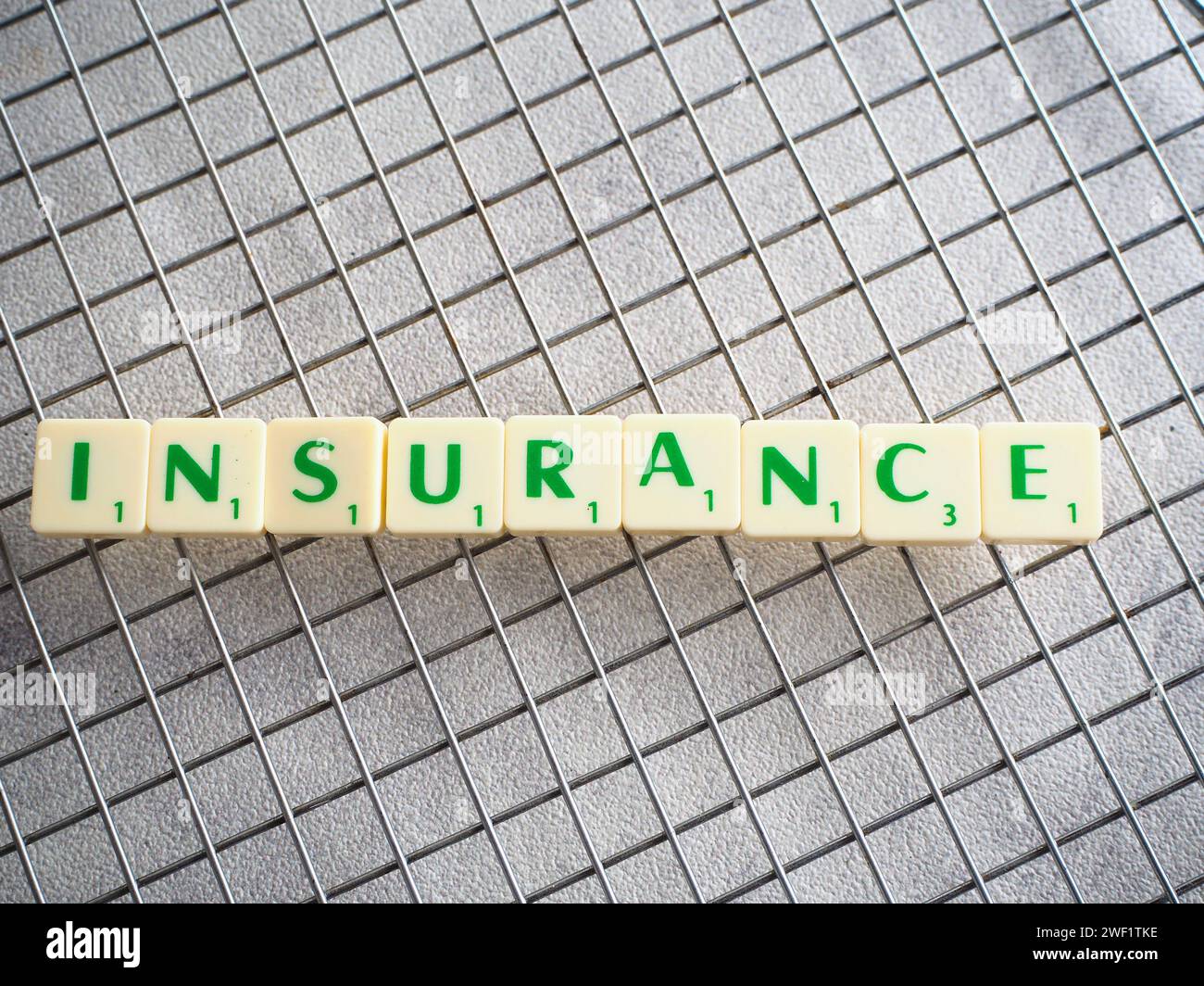 Scrabble letters spelling words INSURANCE Stock Photo - Alamy