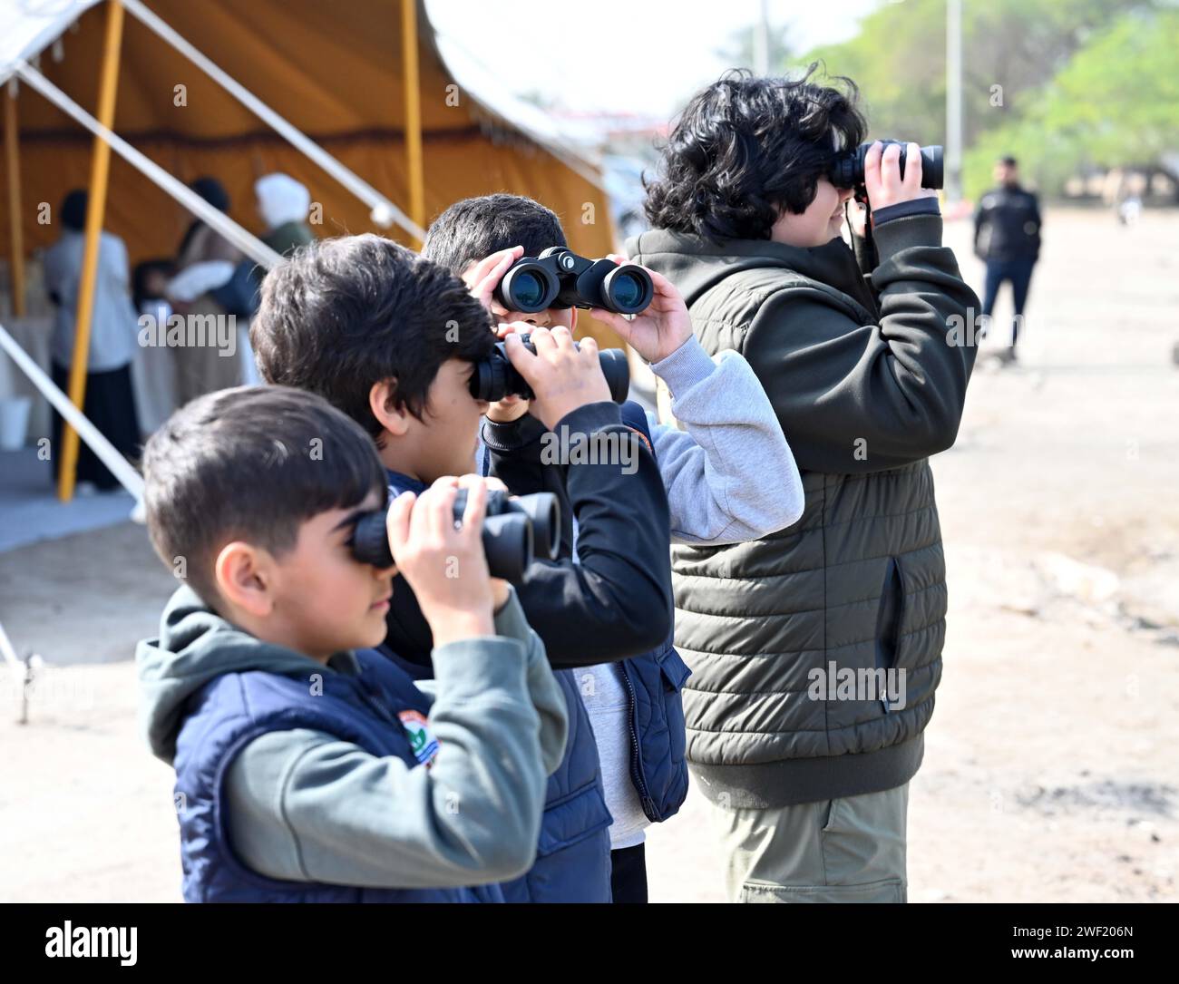 Capital Governorate, Kuwait. 27th Jan, 2024. Kids use telescopes to ...