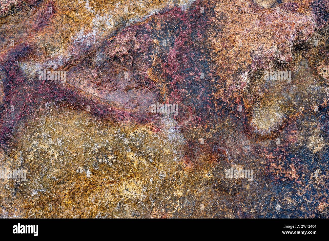stone texture. Rough, unprocessed red and orange stone surface. Natural ...