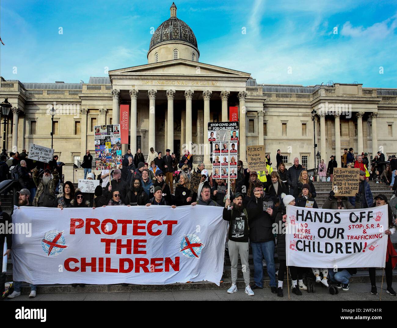 Protesters gather on the steps in front of the National Gallery behind ...