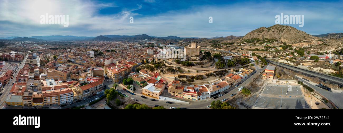 Aerial view of Petrer, medieval town and hilltop castle with restored ...