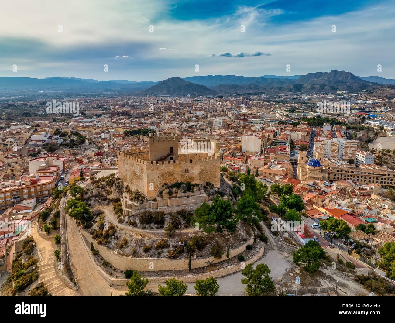 Aerial view of Petrer, medieval town and hilltop castle with restored ...