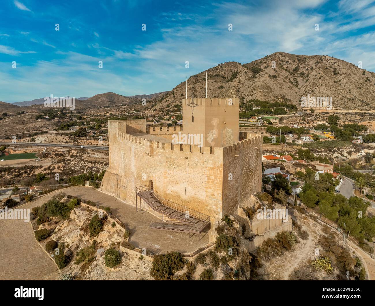 Aerial view of Petrer, medieval town and hilltop castle with restored ...