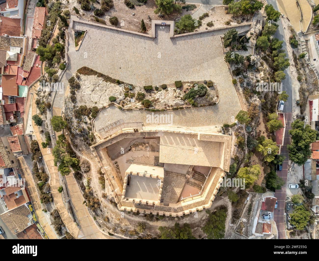 Aerial view of Petrer, medieval town and hilltop castle with restored ...