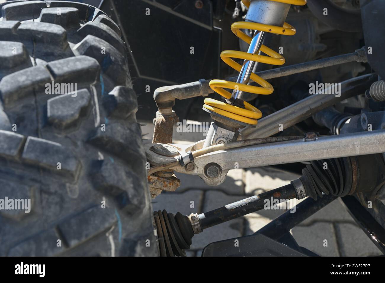 ATV rear suspension springs and shock absorbers Stock Photo - Alamy
