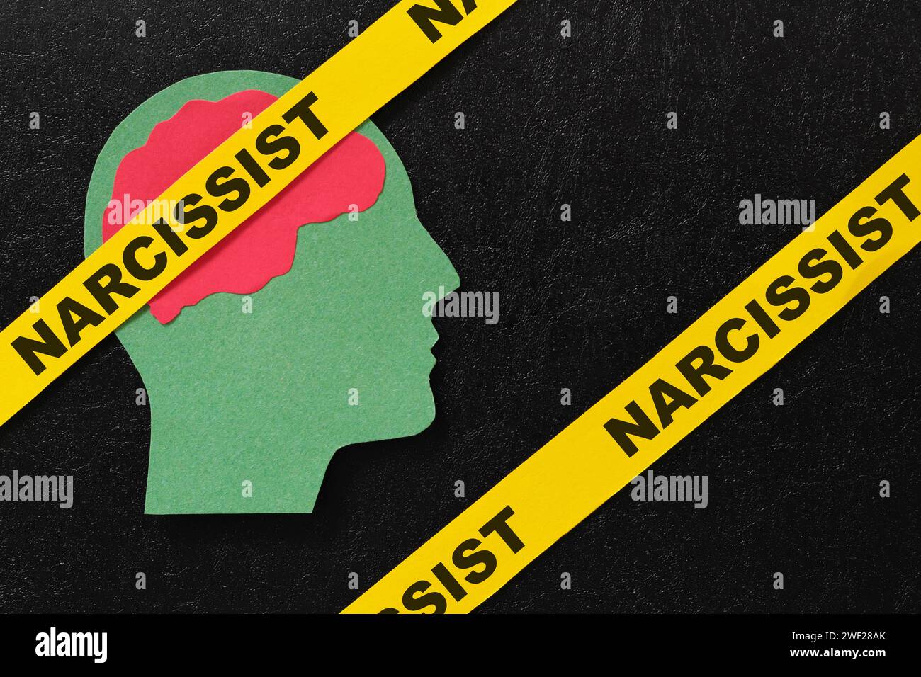 Human head profile with word narcissist in dark black background ...