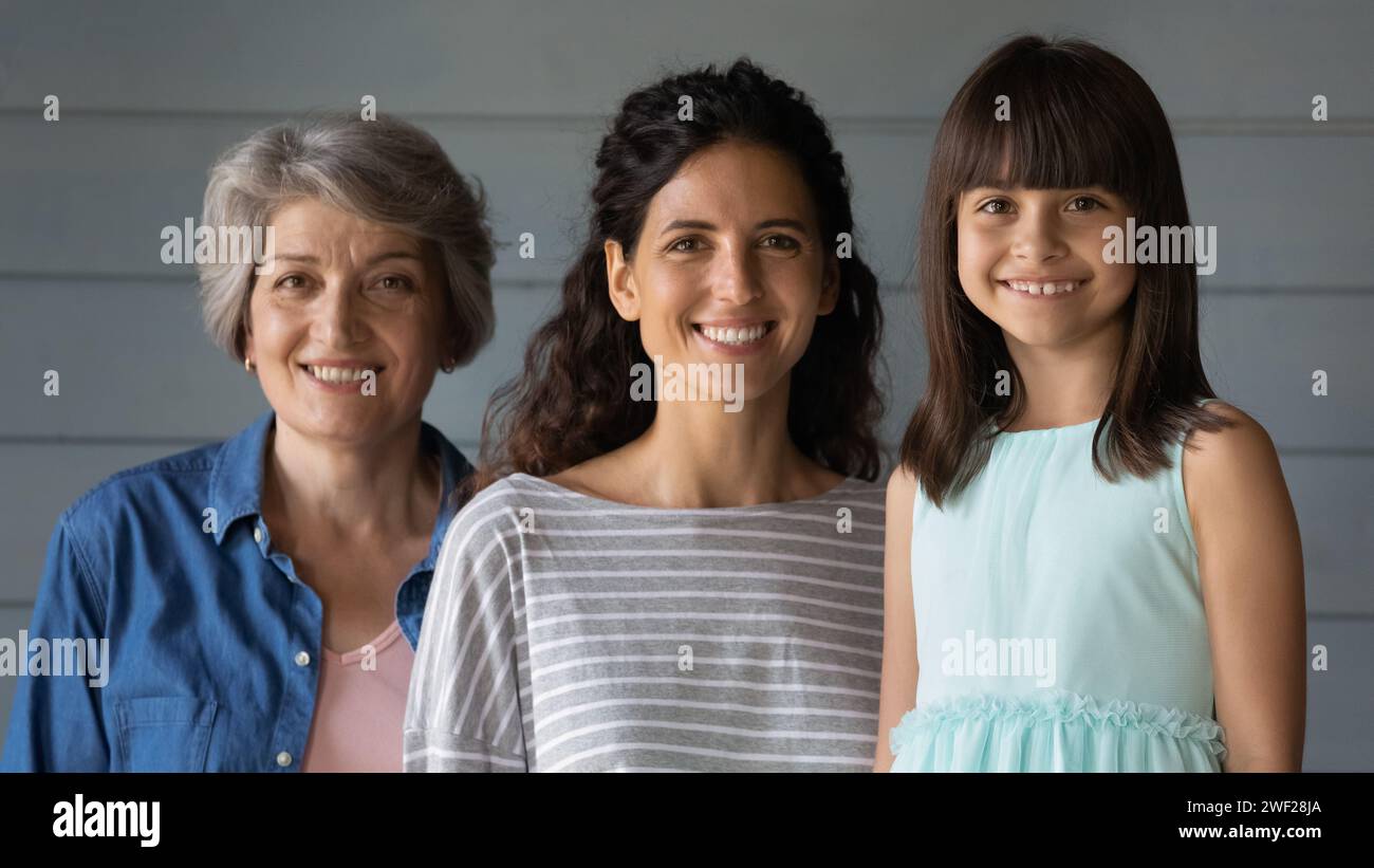 Intergenerational family of 3 diverse age females posing for portrait ...