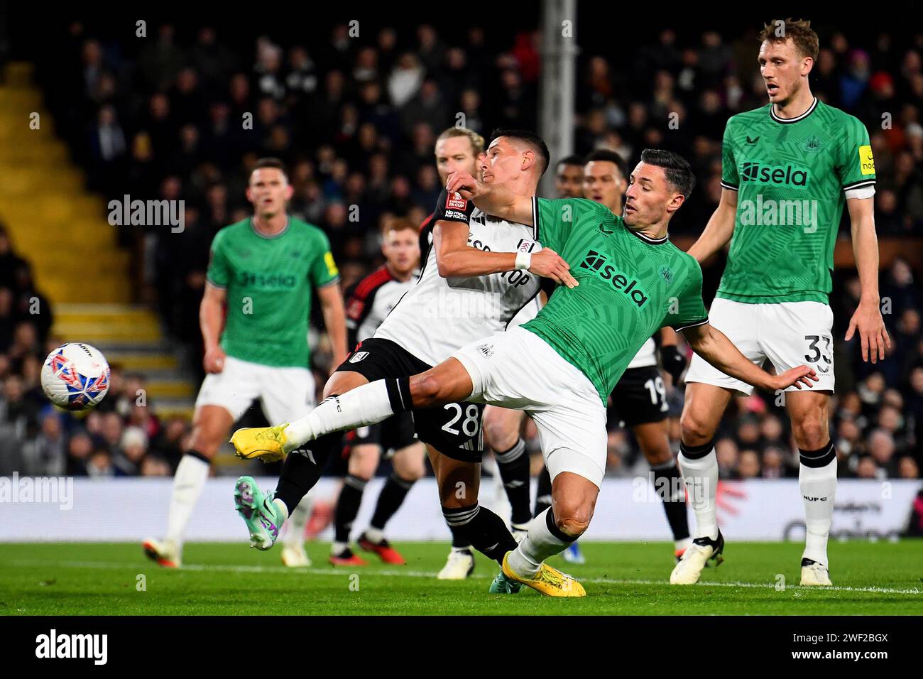 London, UK. 27th Jan, 2024. Sasa Lukic of Fulham and Fabian Schar of ...
