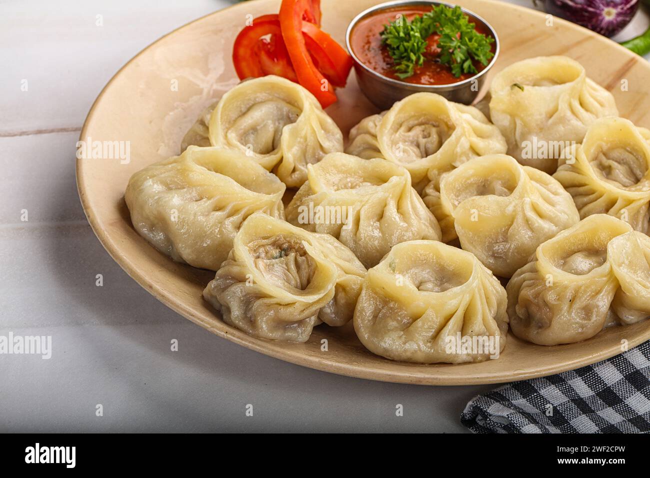 Steamed Nepali dumpling Momo with sauce stuffed chicken, meat, seafood ...