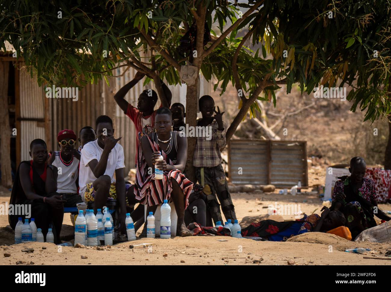 Juba, South Sudan. 26th Jan, 2024. Young men sell milk along the street ...