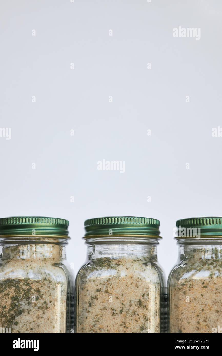 Packaging and storage of homemade seasoning. Three glass jars with ...