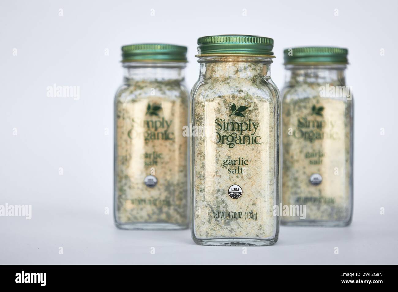 Simply Organic brand garlic salt seasoning. Three glass jars of spices ...