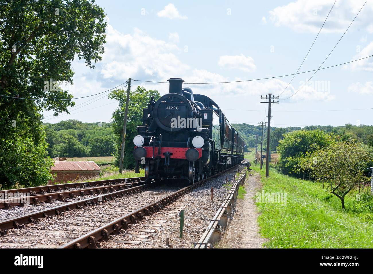 Ivatt Class 2, 41298 tank engine hauls a train into Wootton Station on ...