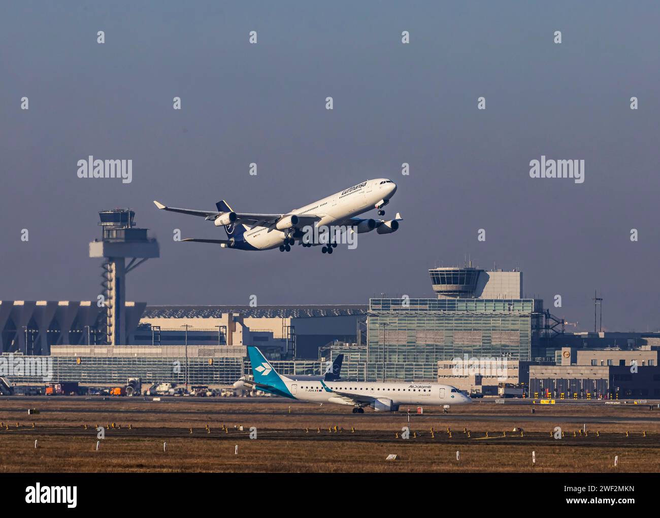 Aircraft taking off at Frankfurt Airport, Fraport Airport with tower. D ...