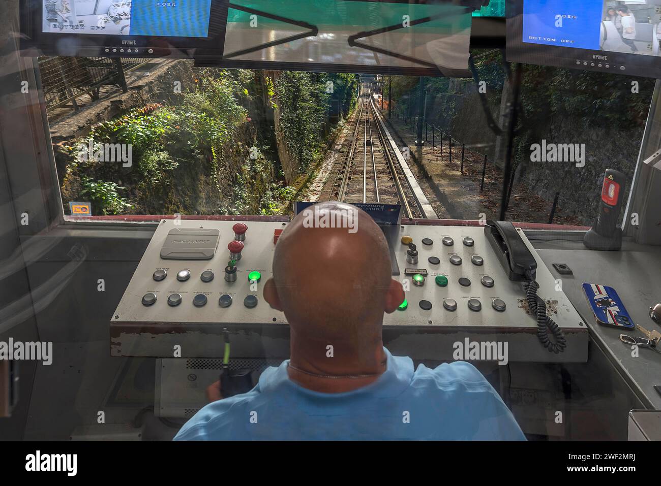 Driver at the driver's desk during the descent of the funicular ...