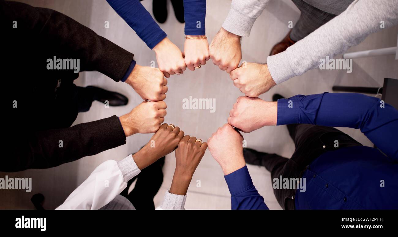 Black hands group fist bump hi-res stock photography and images - Alamy