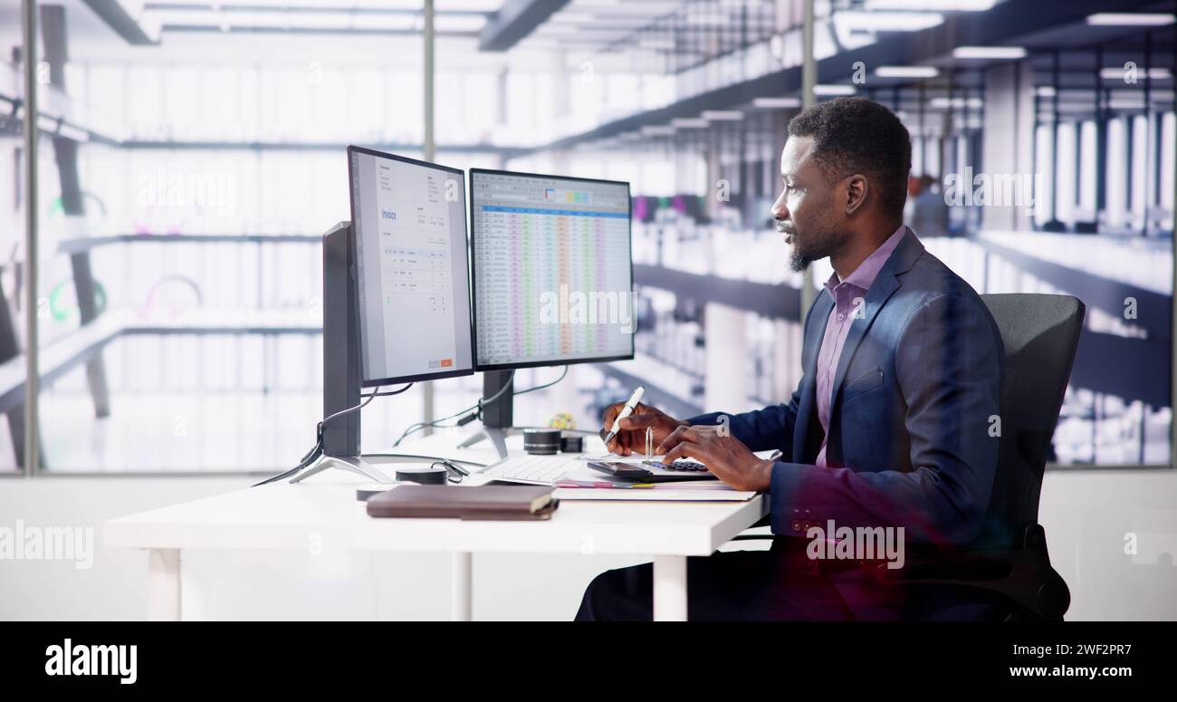 Data Analyst African Man Using Spreadsheet On Computer Stock Photo - Alamy