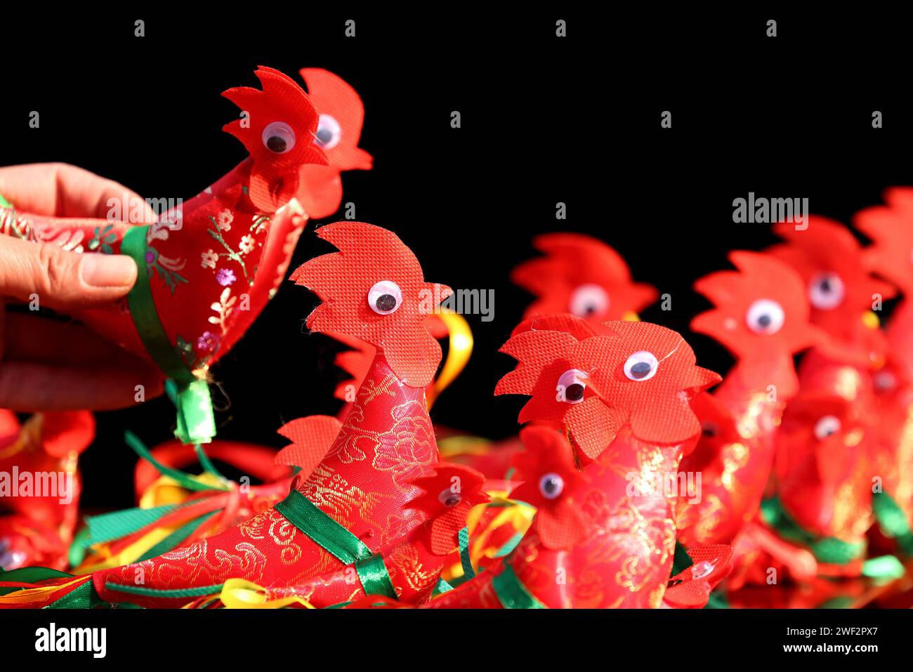 ZAOZHUANG, CHINA - JANUARY 28, 2024 - A folk craftsman displays a hand ...
