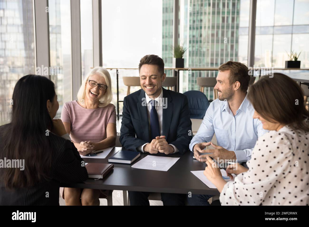 Team of cheerful colleagues having fun on office meeting Stock Photo ...