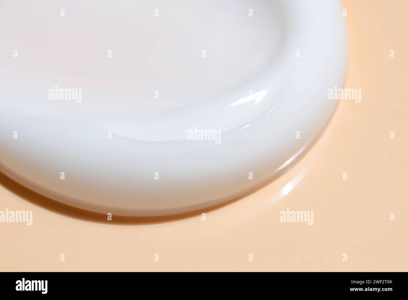 White cosmetic cream texture. lotion swatch on beige background. Beauty ...