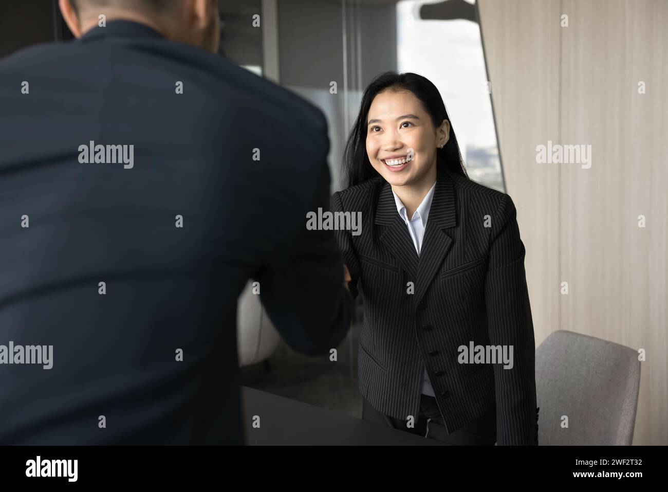 Employer hiring positive pretty young Asian professional woman Stock ...