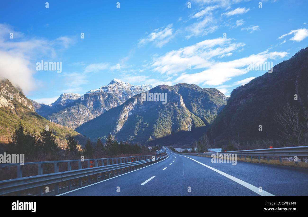 Driving a car on a mountain road. Windshield view of the Alps ...