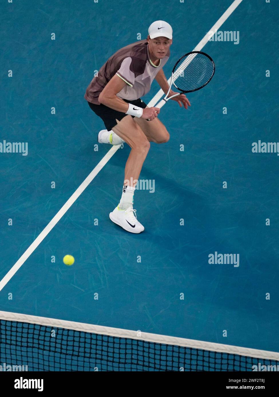 Jannik Sinner of Italy hits a backhand to Daniil Medvedev of Russia ...