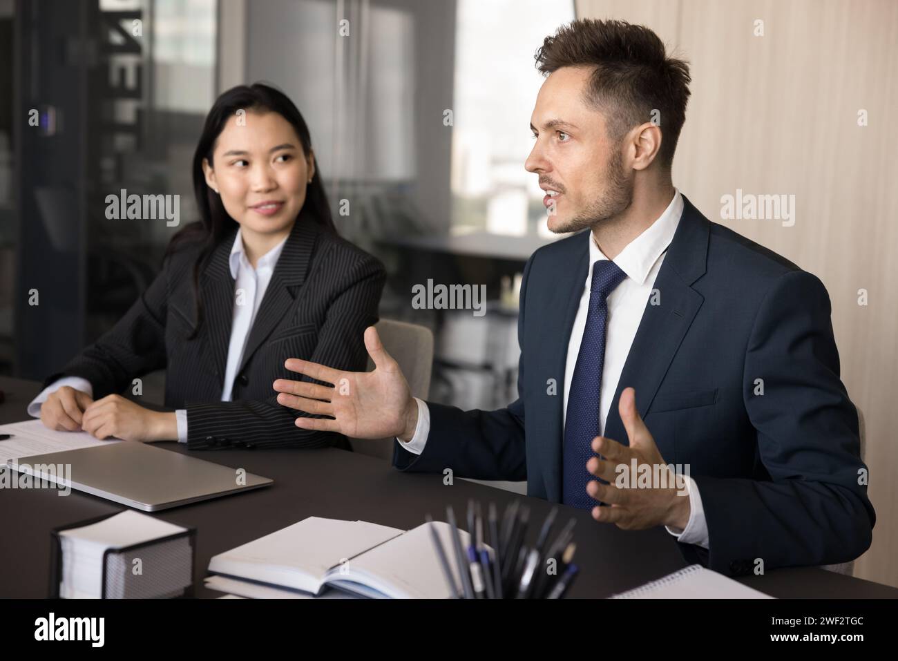 Engaged inspired business professional man offering ideas for team ...