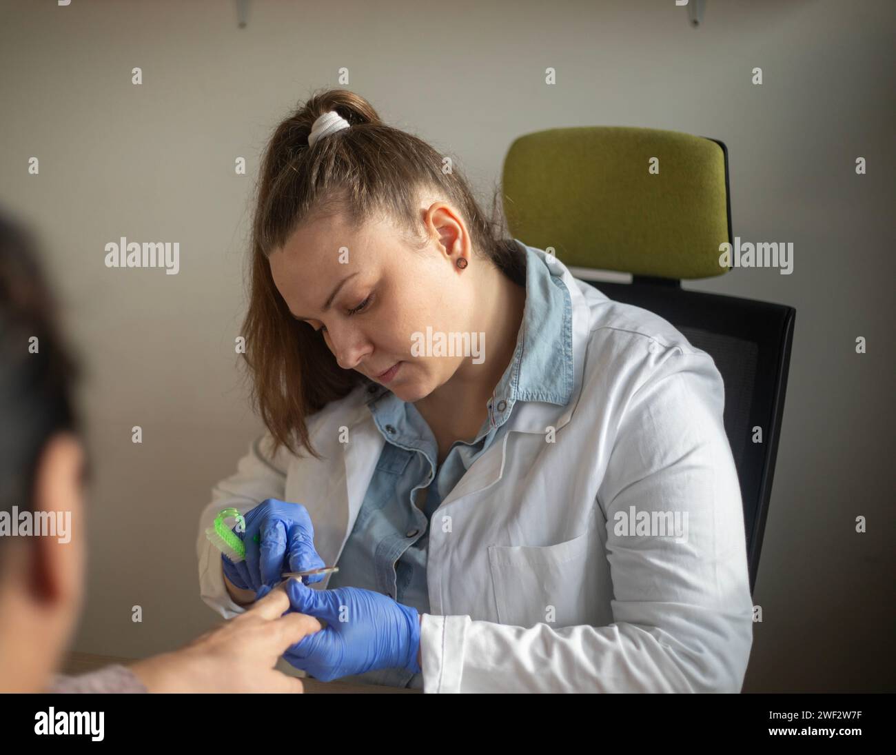 Woman file filing nails hi-res stock photography and images - Alamy
