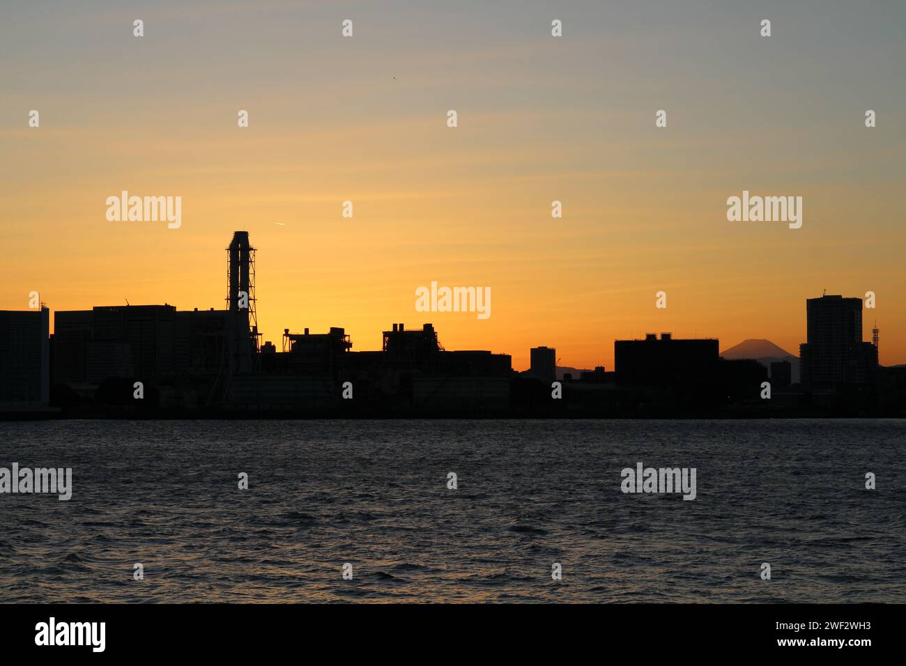 Mount Fuji over oil plants in dusk at Oi Container Terminal in Tokyo ...
