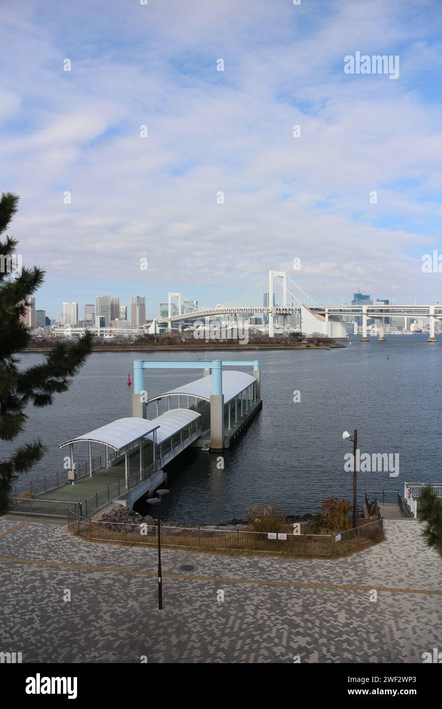 Rainbow Bridge and viewed from Odaiba Seaside Park Pier in Tokyo, Japan ...