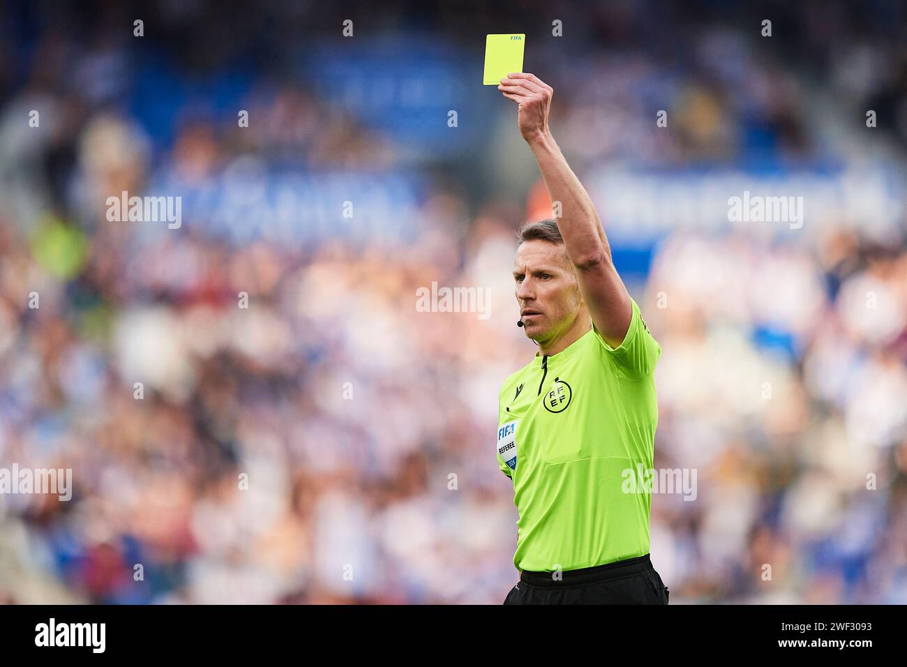 Match Referee Alejandro Jose Hernandez Hernandez shows a yellow card ...