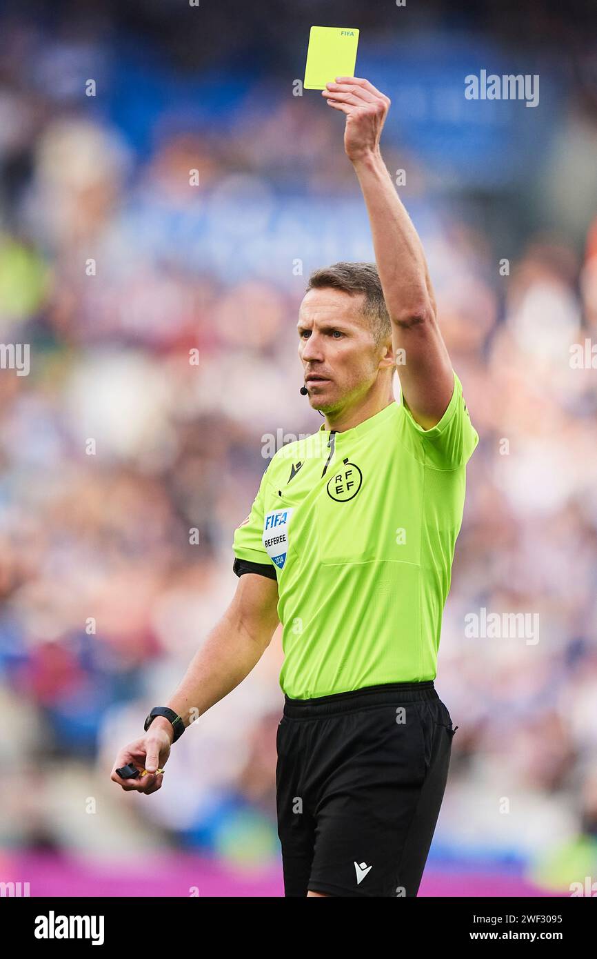Match Referee Alejandro Jose Hernandez Hernandez shows a yellow card ...