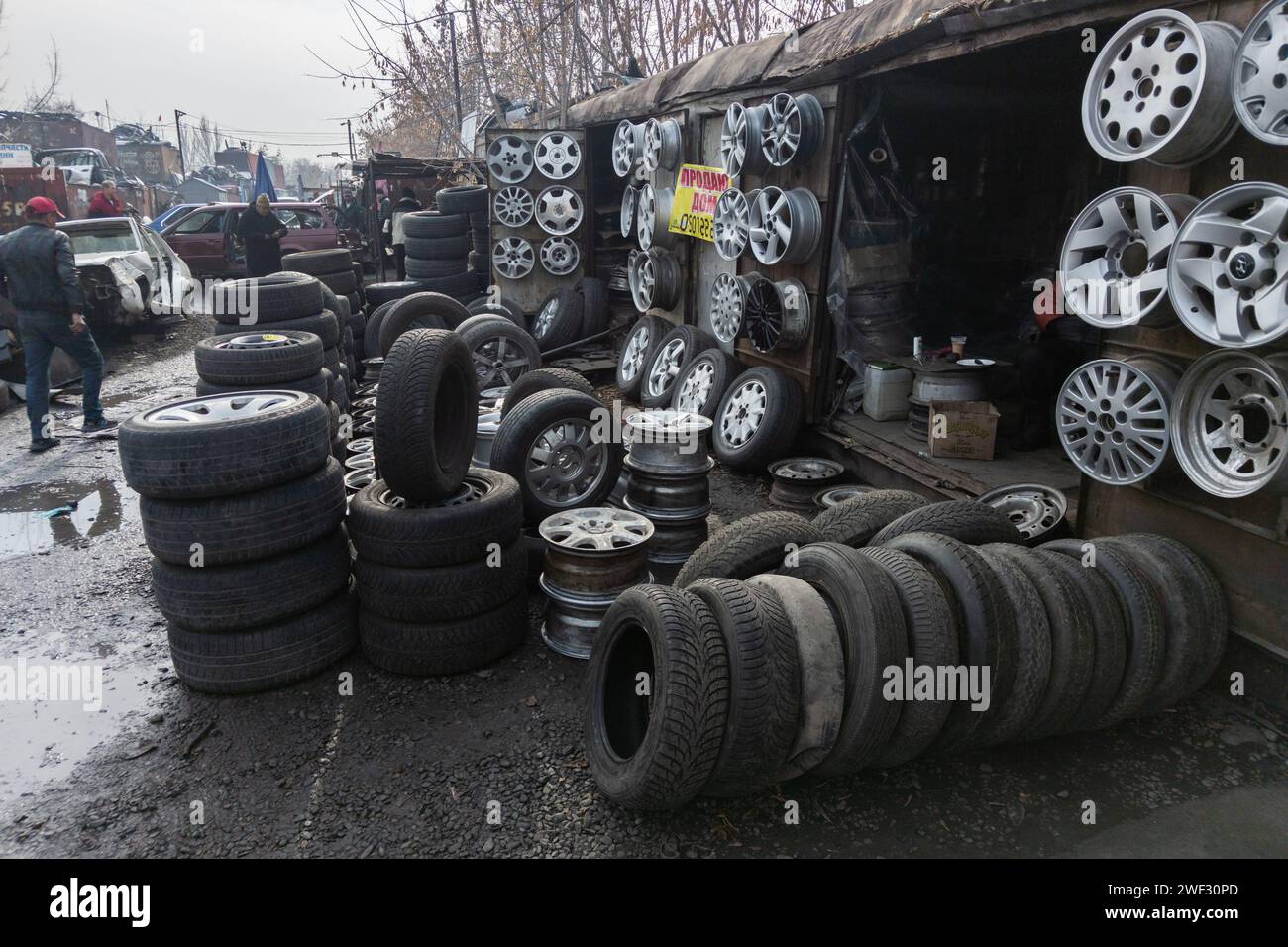 used wheels, rims and tires selling at car parts market in Kudaybergen ...