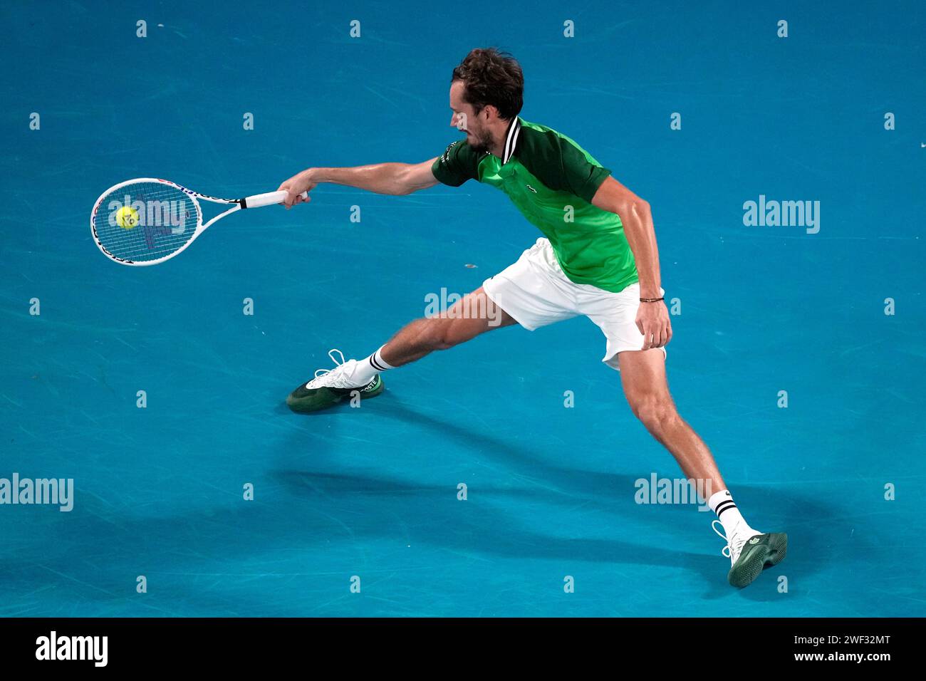 Daniil Medvedev of Russia hits a forehand to Jannik Sinner of Italy ...