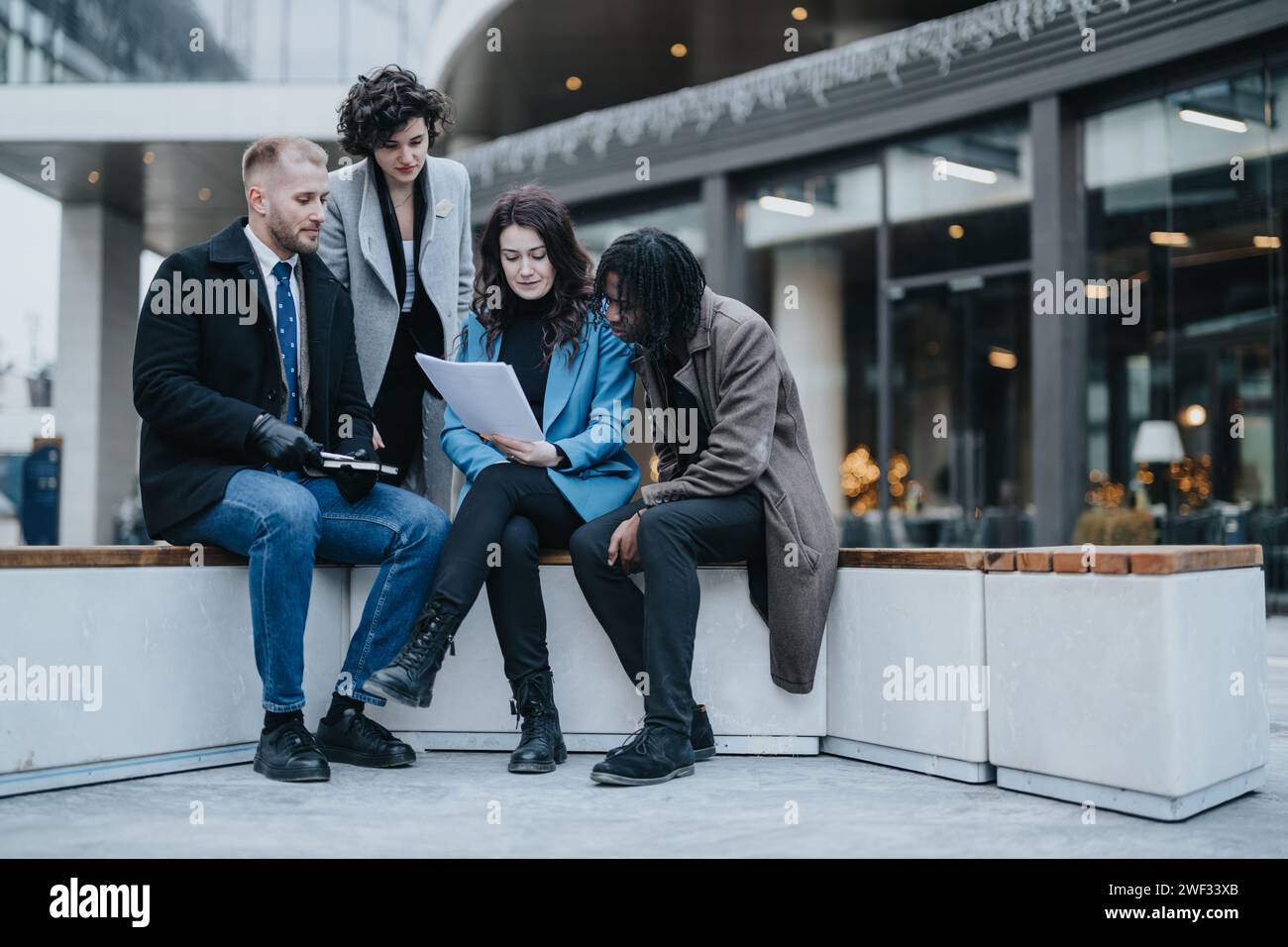 Reviewing document diverse coworkers hi-res stock photography and ...