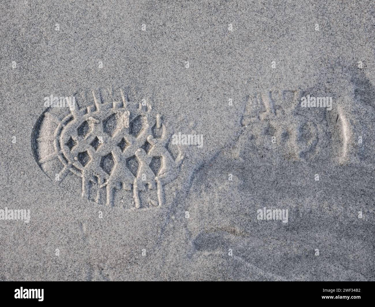 This image captures the detailed imprint of a hikers boot sole left on ...