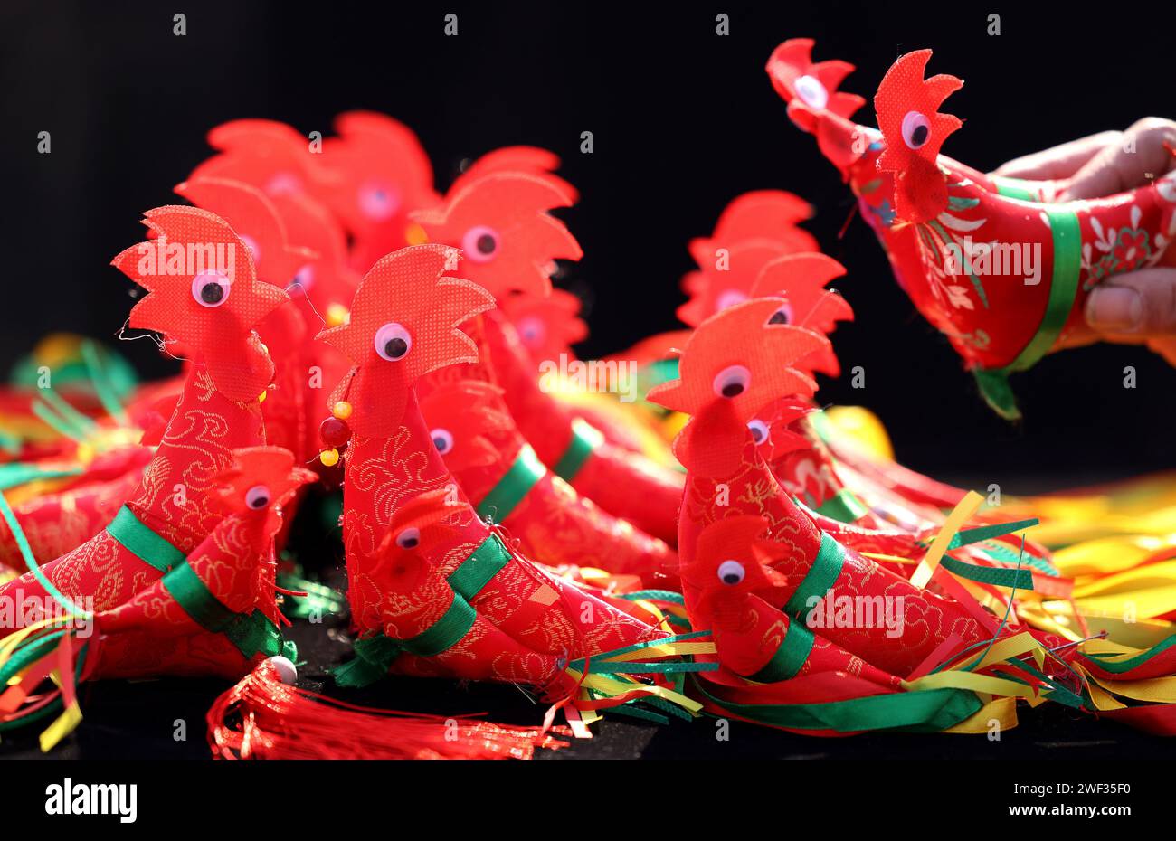 A folk craftsman is displaying a hand-sewn ''spring chicken'' at a New ...