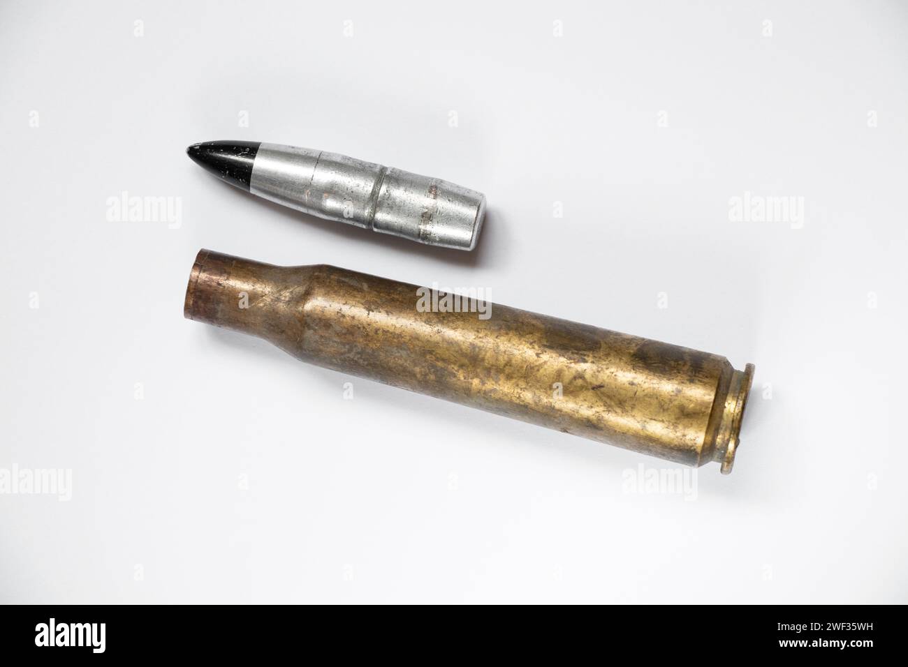 Armor-piercing bullet on a white background close-up, weapons and ...